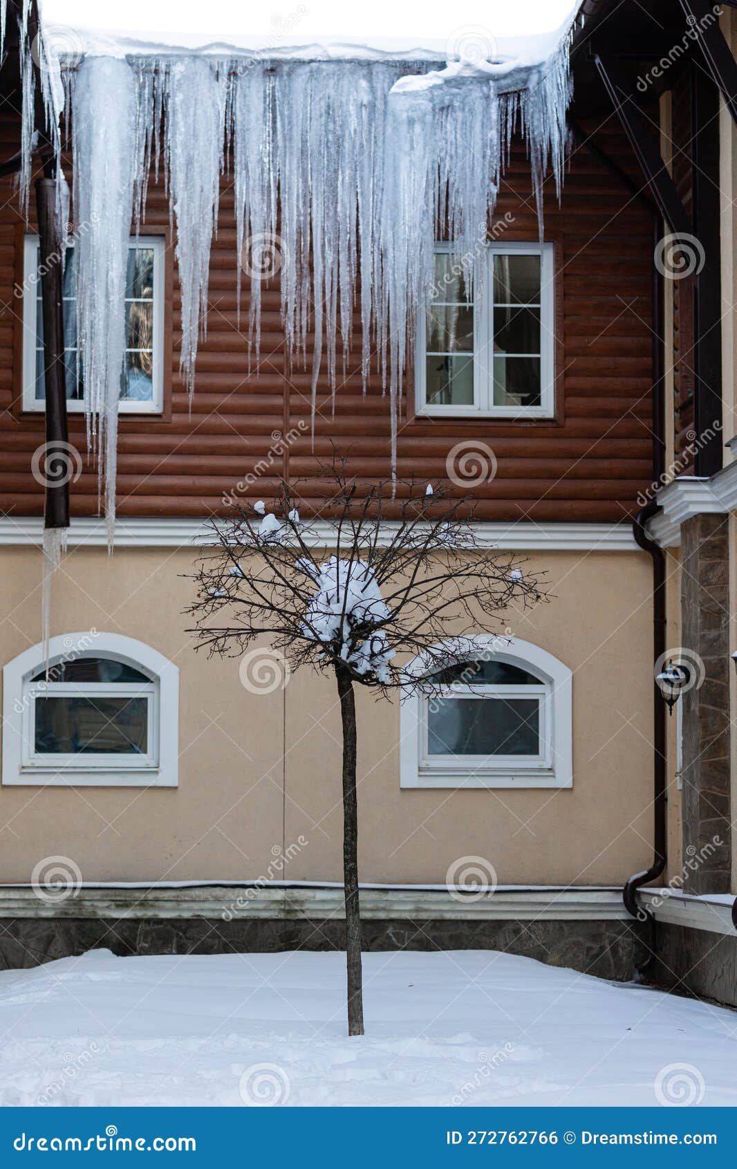 Huge Icicles on the Roof of the House. Danger from Falling Icicles ...
