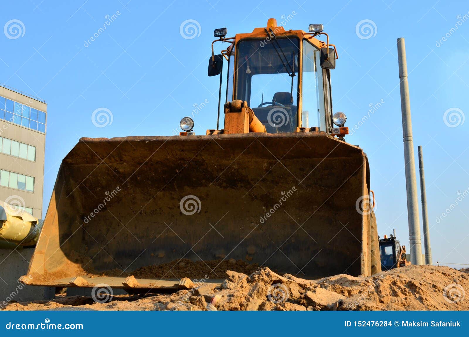 Huge Iron Bucket Front Loader at a Construction Site Stock Photo ...