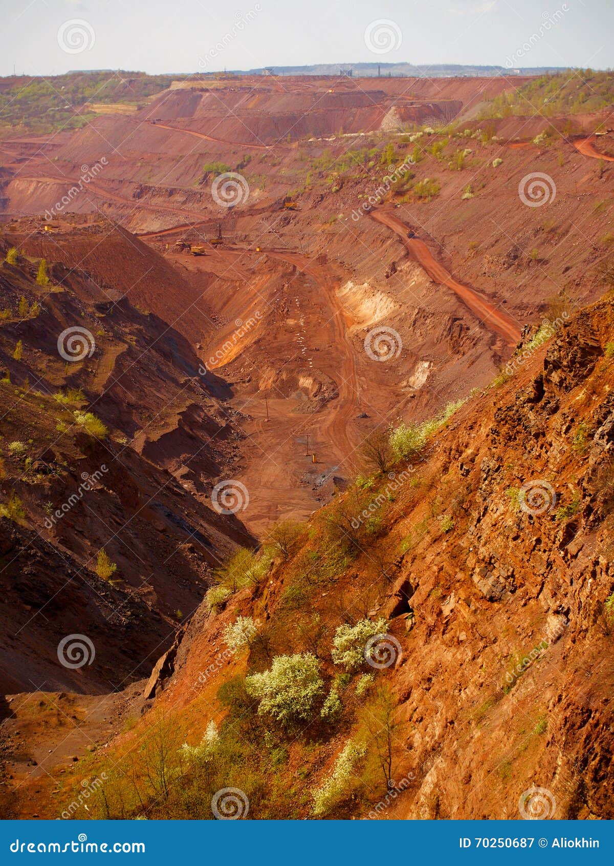 Huge iron open-pit mine stock image. Image of machinery - 70250687