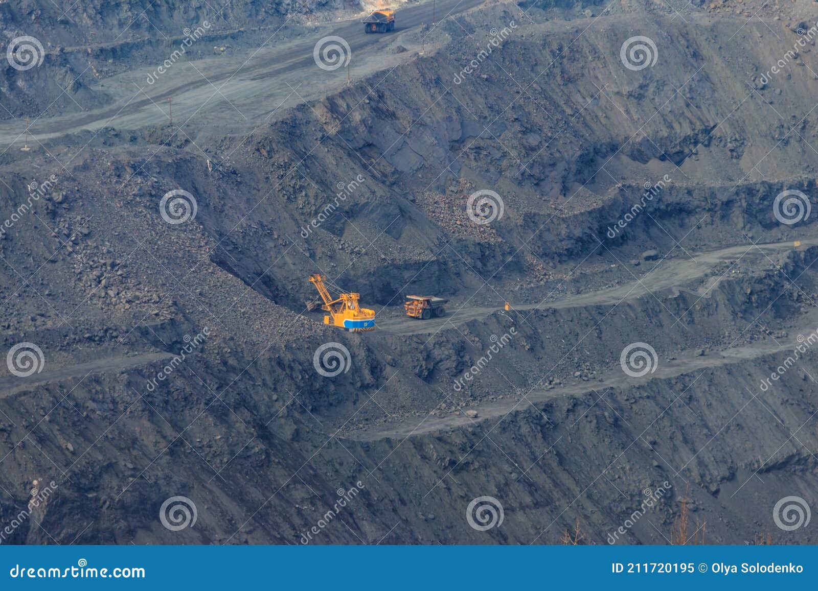 Huge Iron Ore Quarry with Working Dump Trucks and Excavators Stock ...