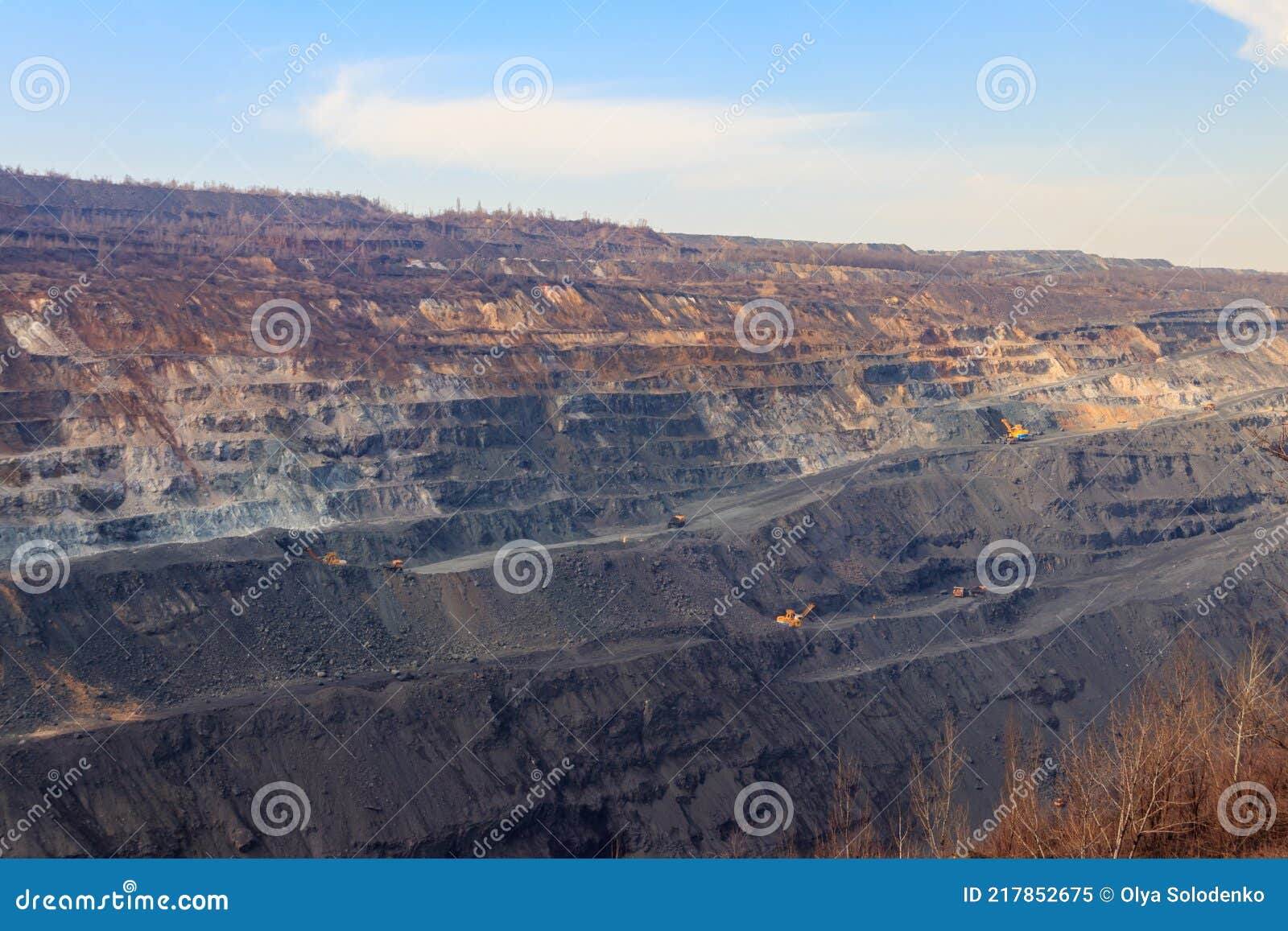 Huge Iron Ore Quarry with Working Dump Trucks and Excavators Stock ...