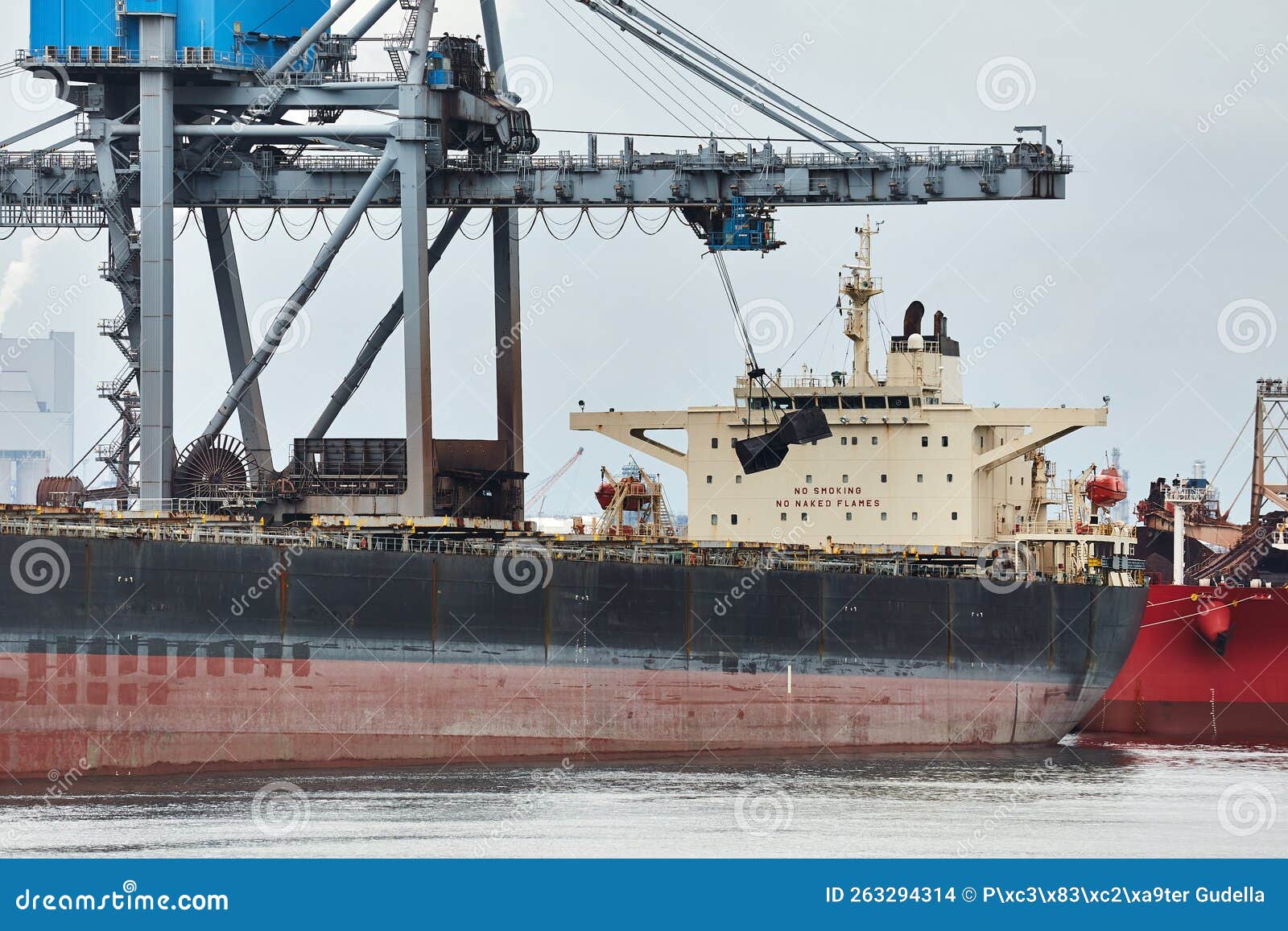 Unloading a huge ship stock photo. Image of rotterdam - 263294314