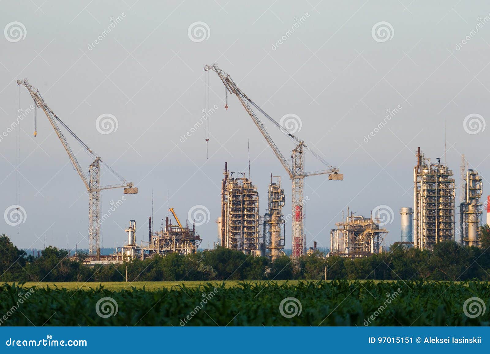 A Huge Oil Refinery with Cranes Under Construction Stock Image - Image ...