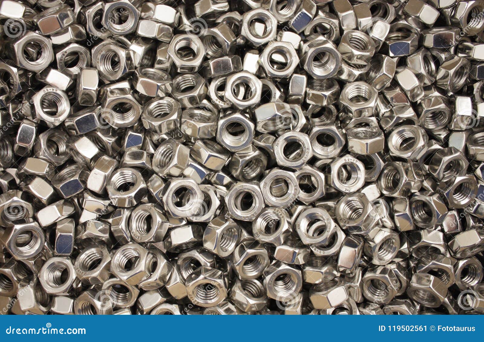 A huge pile of metal nuts stock image. Image of background - 119502561