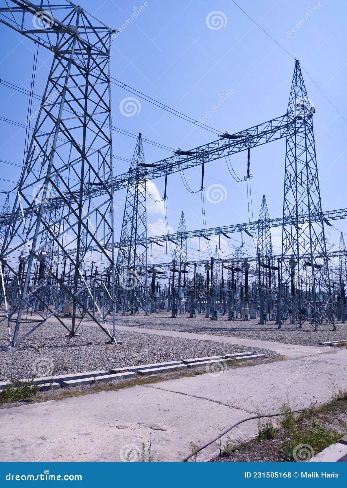 Huge Power Substation. High Voltage Electric Tower on Sky Background ...