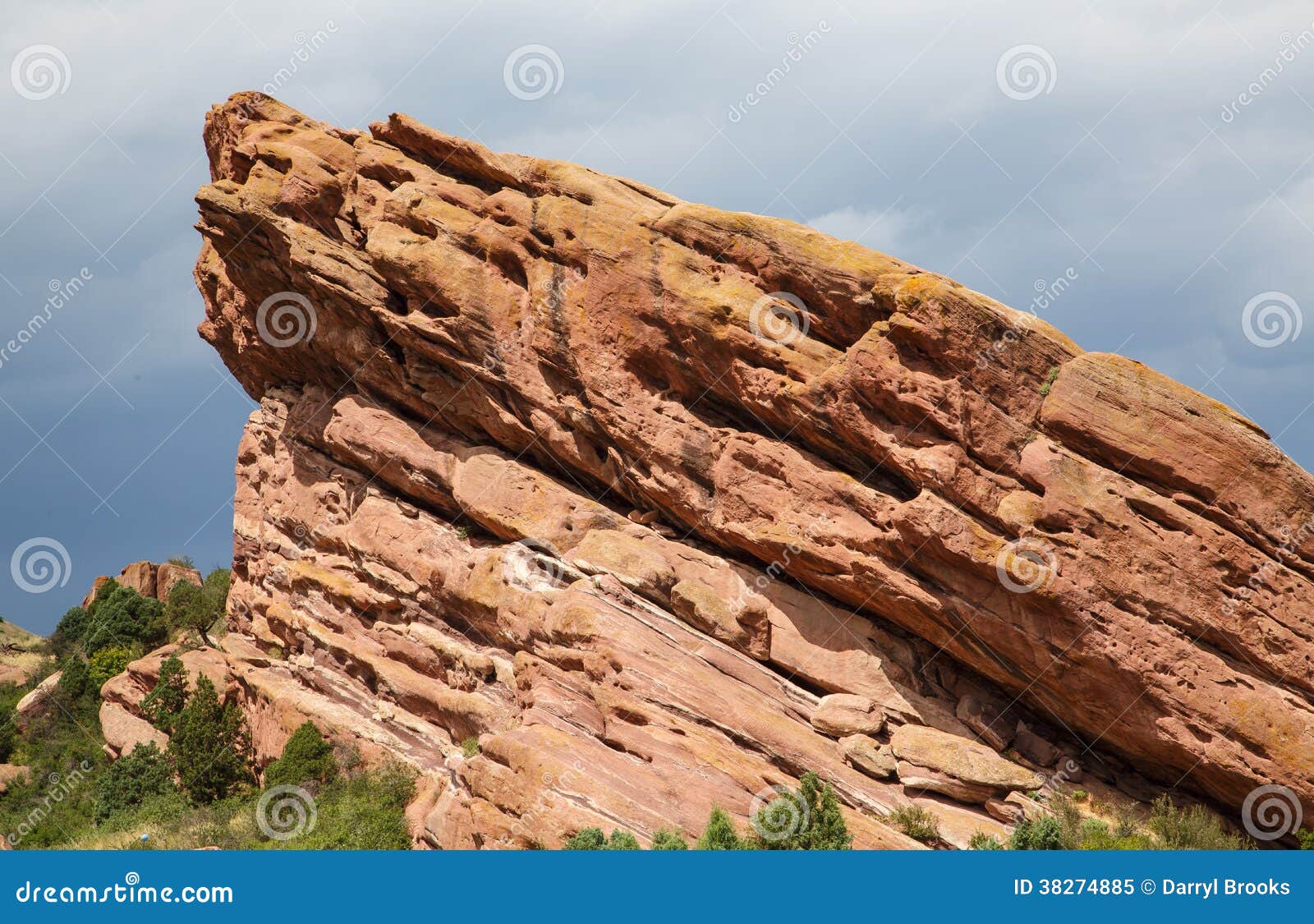 Huge Red Boulder Under Cloudy Sky Stock Image - Image of rocky, desert ...
