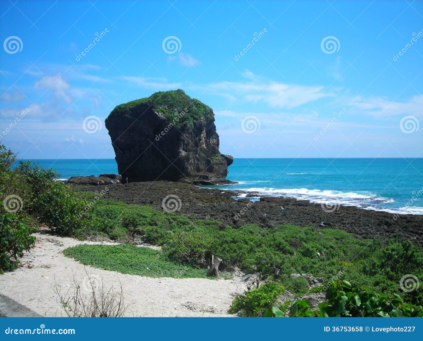 Huge rock by the sea stock photo. Image of shape, cloud - 36753658