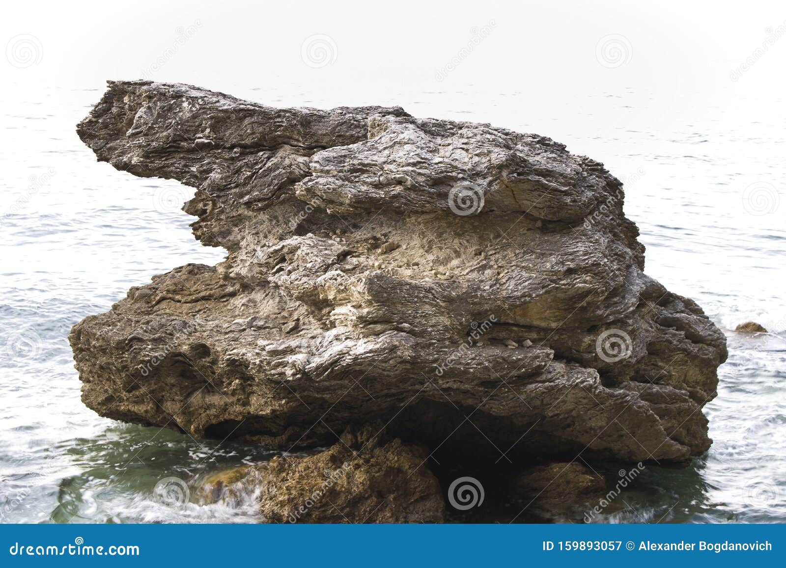 A Huge Rock in the Sea Water. Stone on the Seashore Stock Image - Image ...