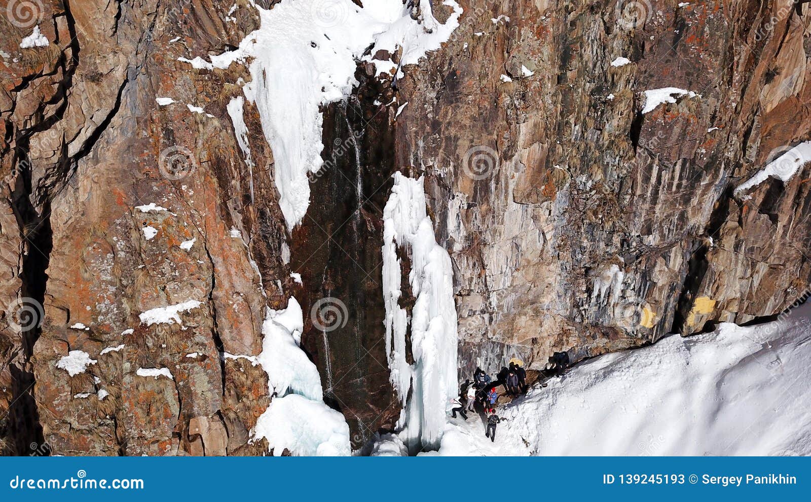 A Huge Snow Cliff. Flows Down the Waterfall. Huge Icicles and Ice Stock ...