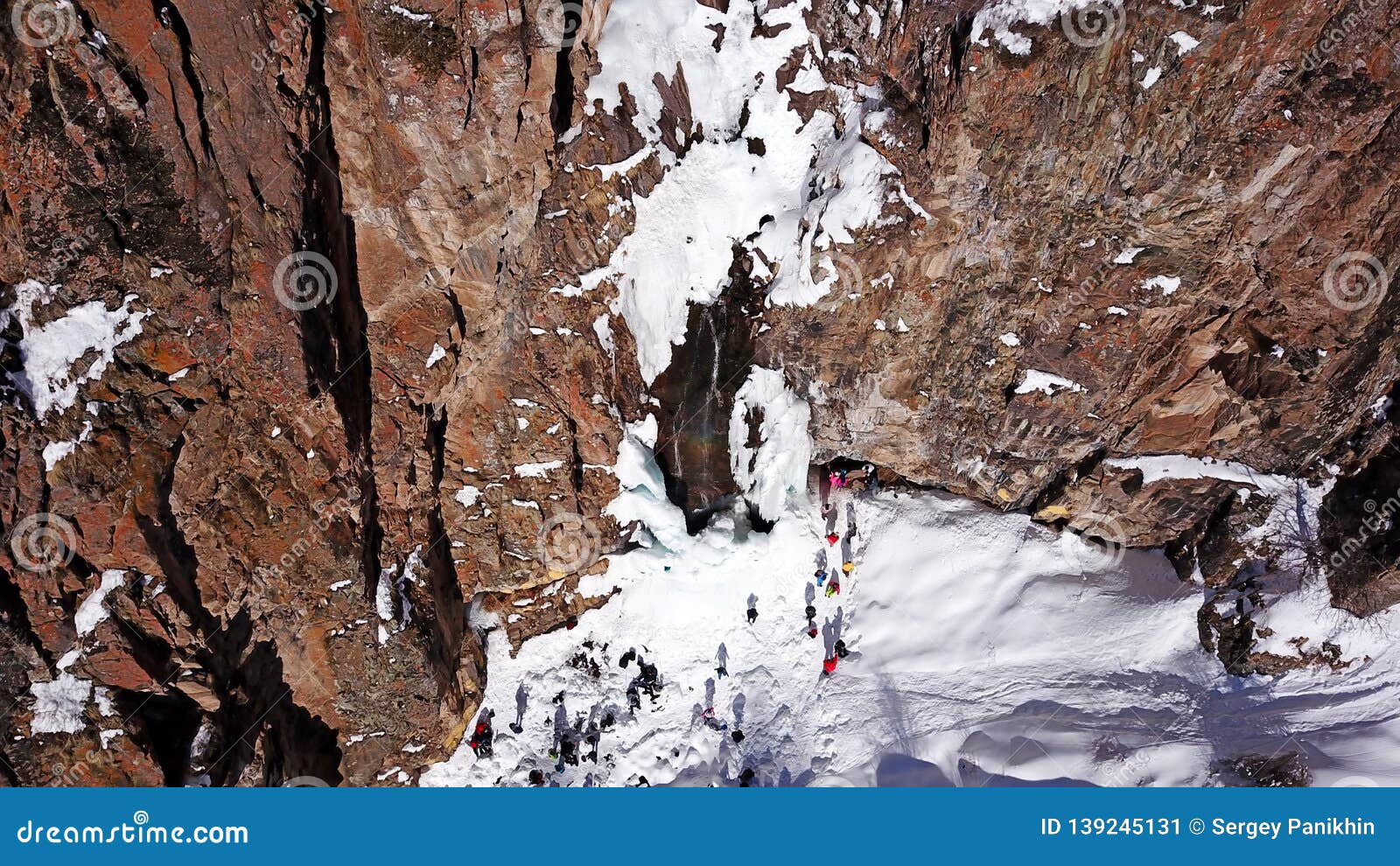 A Huge Snow Cliff. Flows Down the Waterfall. Huge Icicles and Ice Stock ...