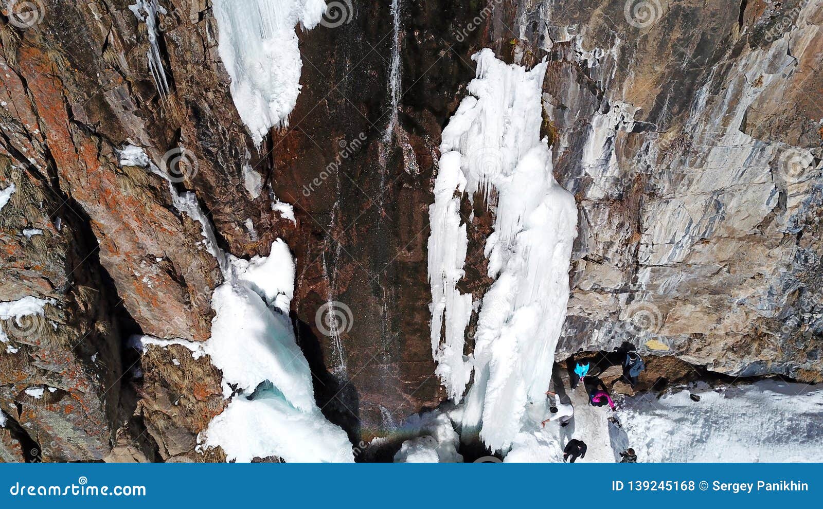 A Huge Snow Cliff. Flows Down the Waterfall. Huge Icicles and Ice Stock ...