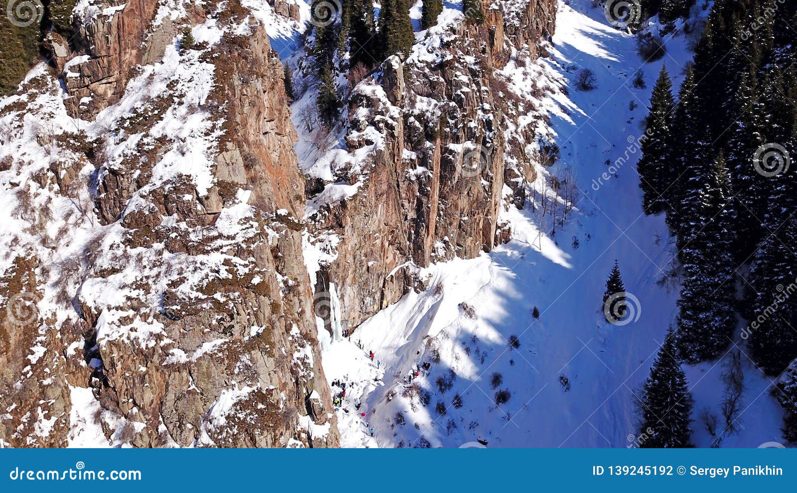 A Huge Snow Cliff. Flows Down the Waterfall. Huge Icicles and Ice Stock ...