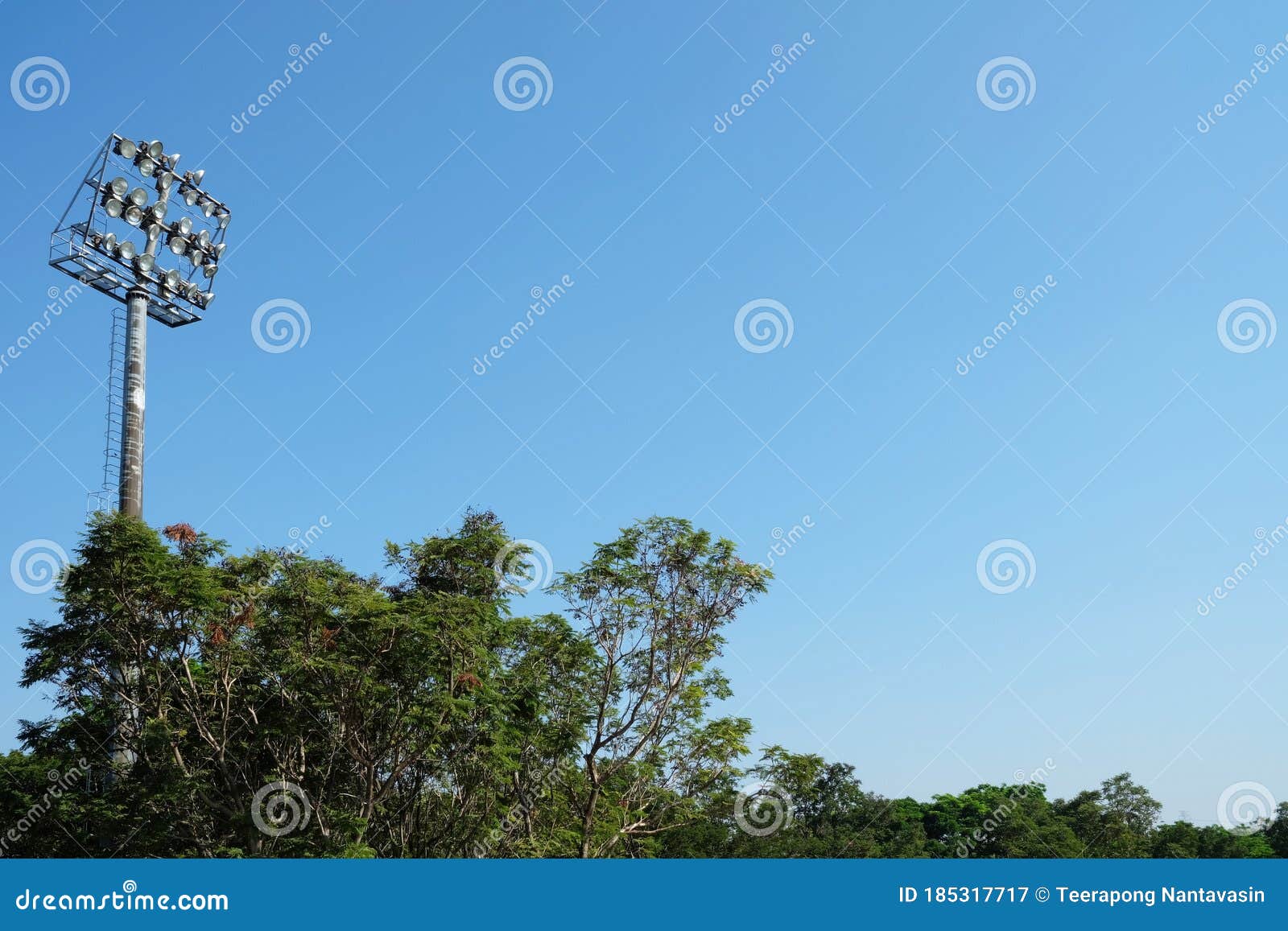 Huge Spotlight Pole with Blue Sky Background. Stock Image - Image of ...