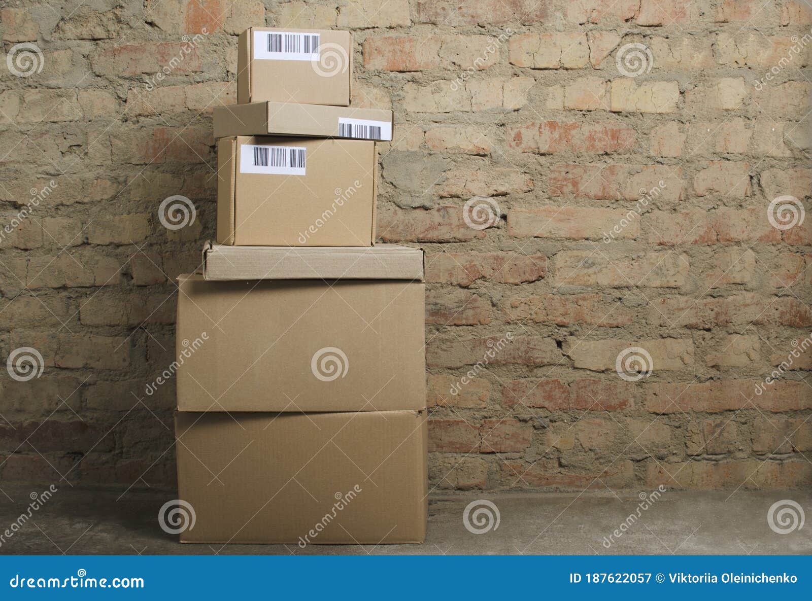 Huge Stack of Parcel Boxes on the Floor Against Brick Wall.Empty Space ...