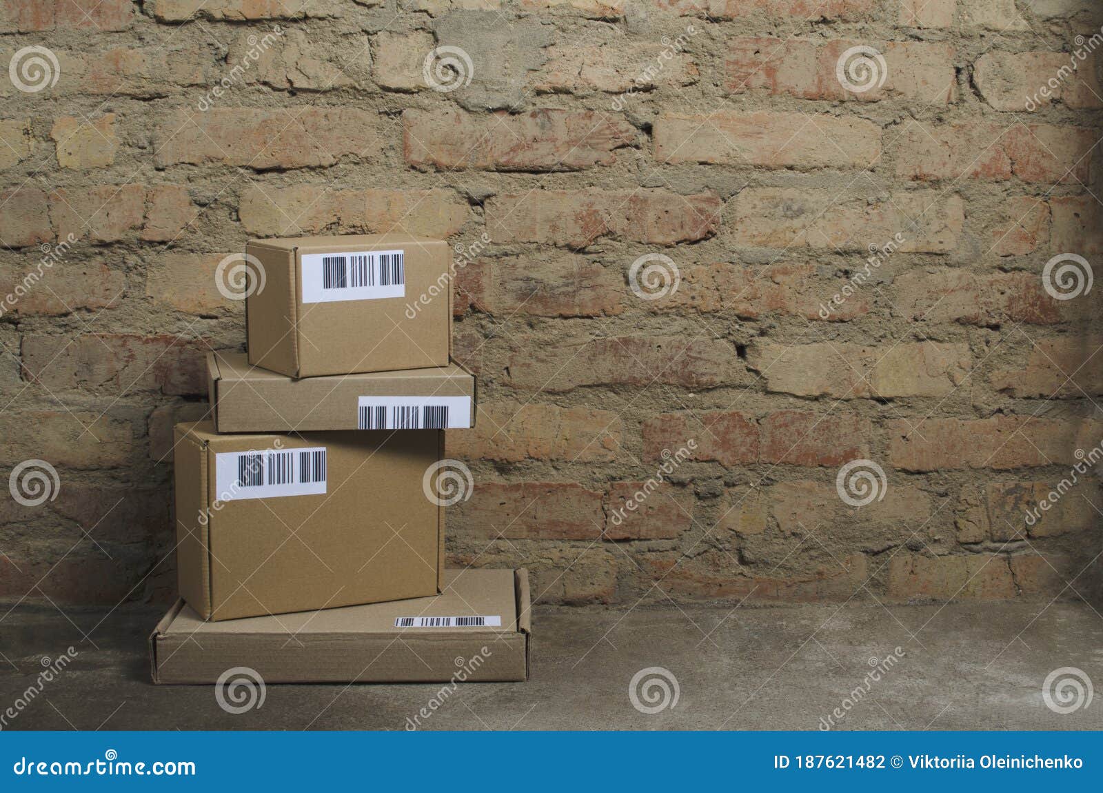 Stack of Parcels on the Floor Against Brick Wall.Empty Space.Storage ...