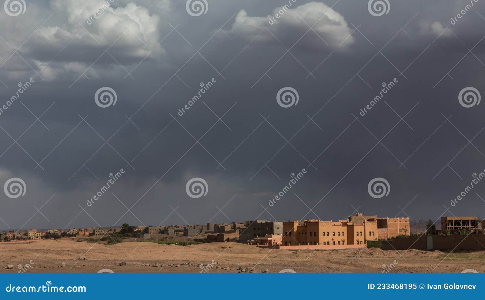 A Huge Thundercloud is Approaching a Small Arab City in the Desert ...