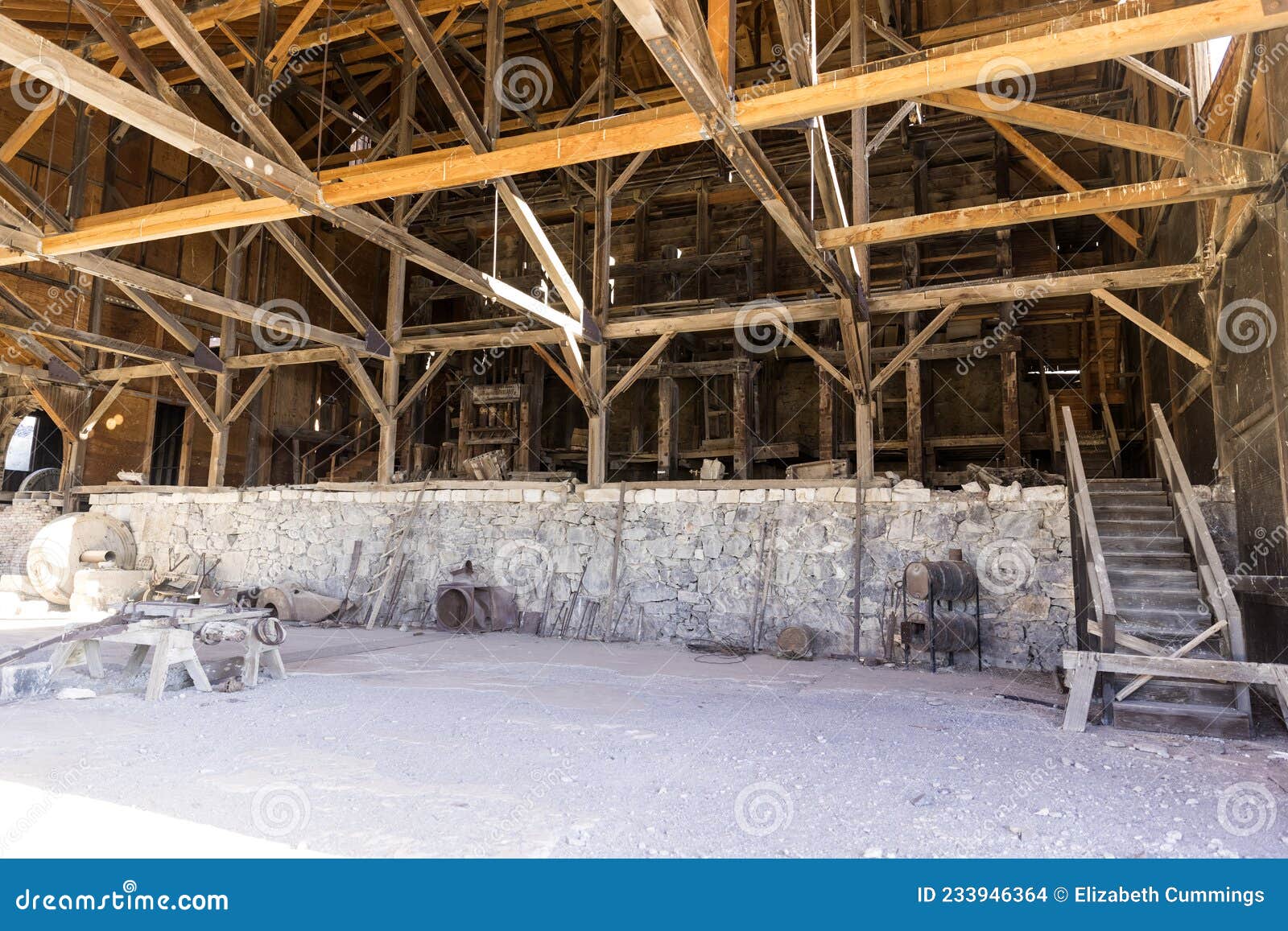 Huge Wooden Building with Concrete Structures and Ore Processing Wheels ...
