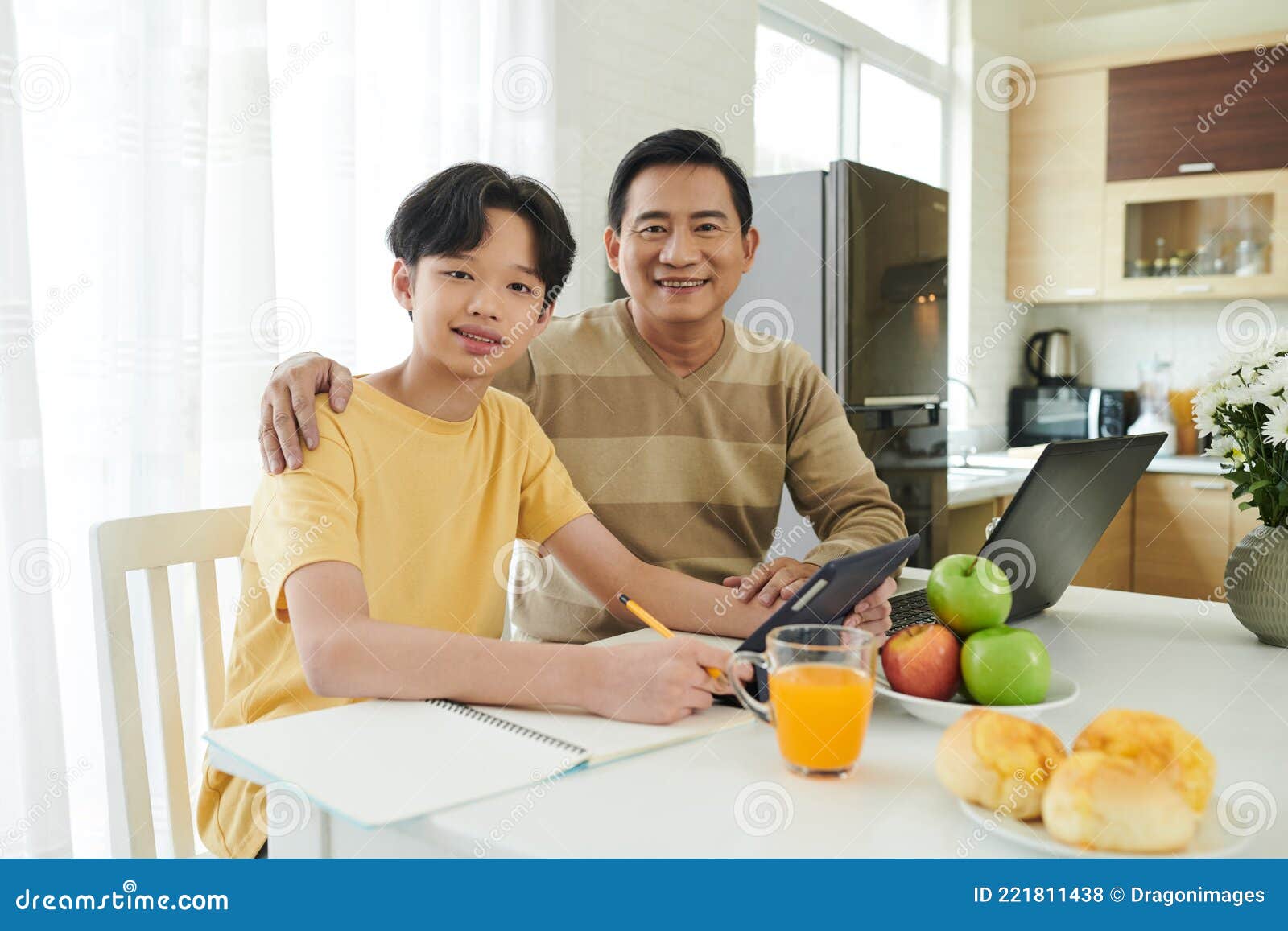 Hugging Father and Son at Kitchen Table Stock Photo - Image of hobby ...