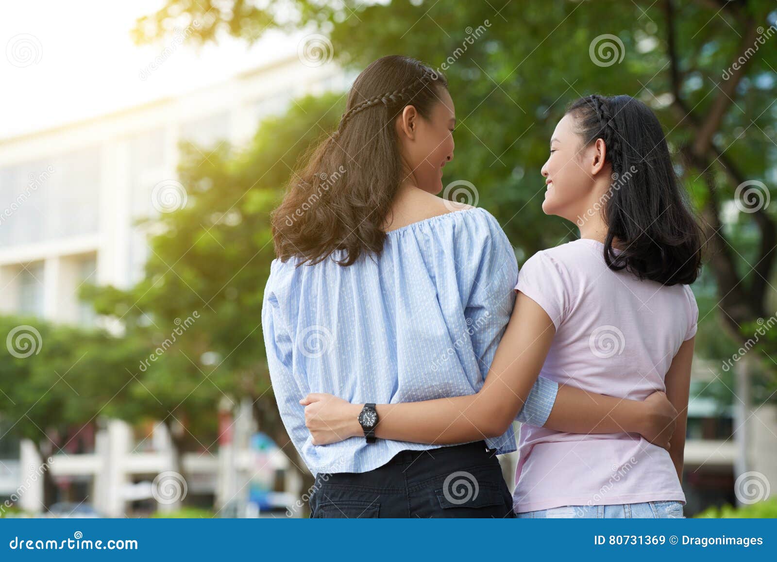 Hugging sisters stock image. Image of affectionate, walking - 80731369