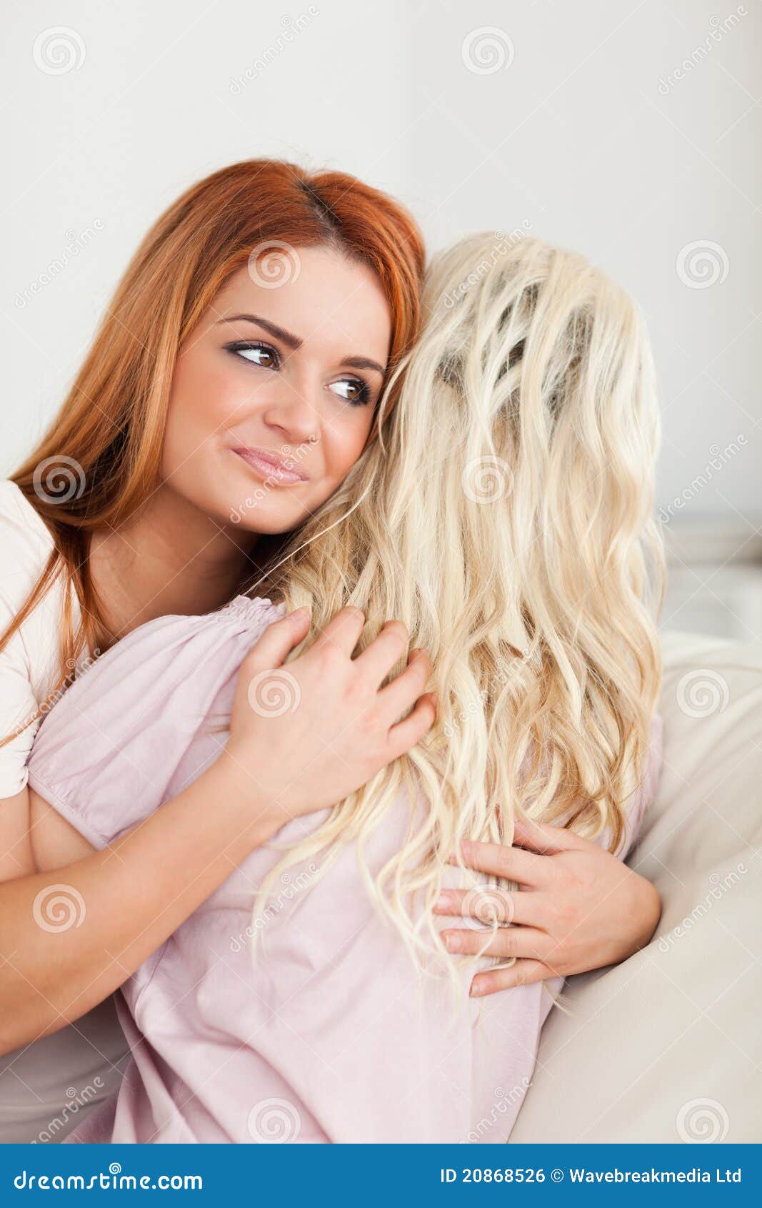 Hugging Smiling Women Sitting on a Sofa Stock Photo - Image of active ...