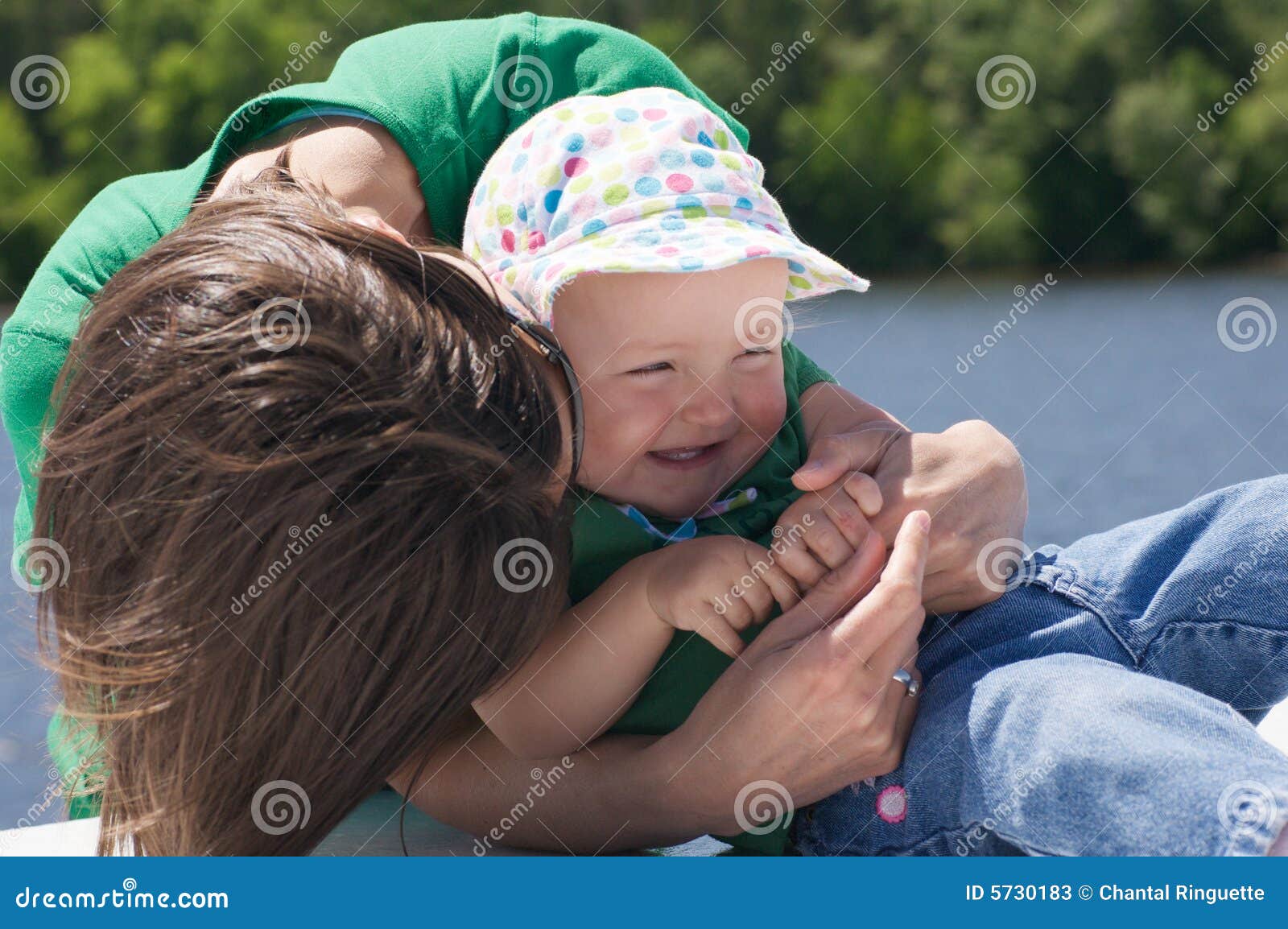 Hugs from mommy stock image. Image of playing, kiss, girls - 5730183