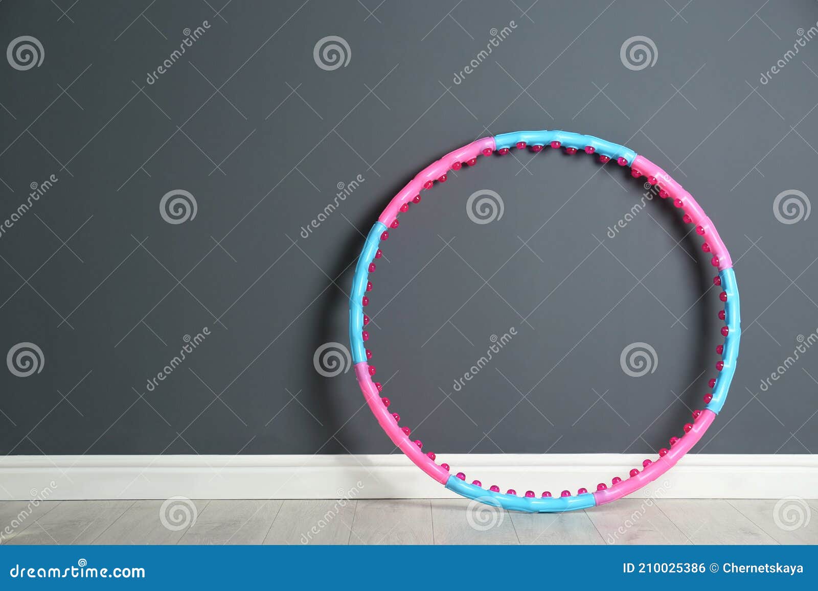 Hula Hoop Near Grey Wall in Gym. Space for Text Stock Photo - Image of ...