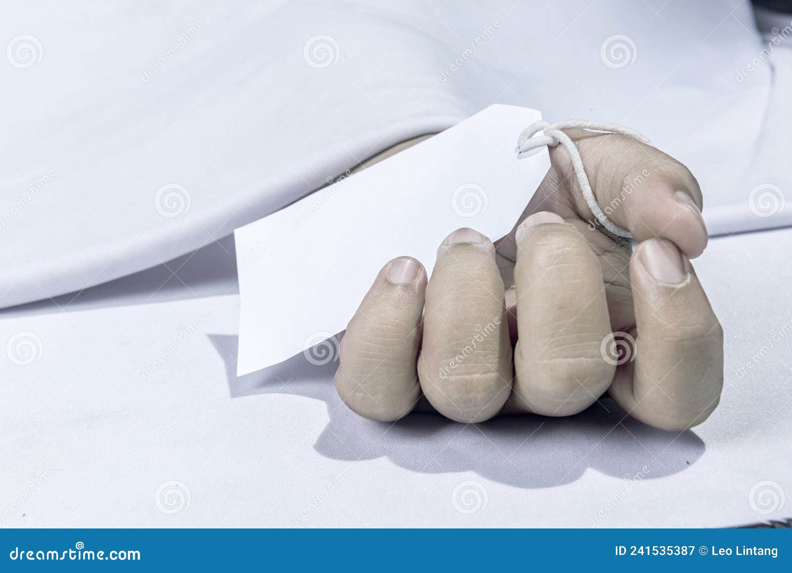 Human Corpse Covered with a Sheet and Name Tag on Hand Stock Image ...
