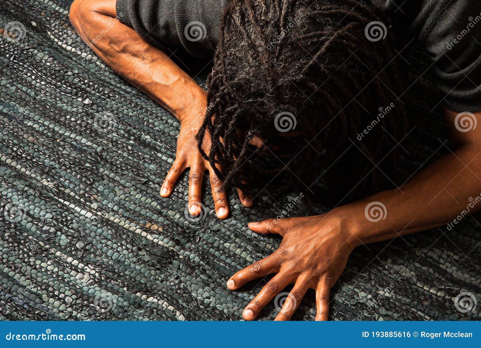Human down on a rug stock photo. Image of hair, african - 193885616