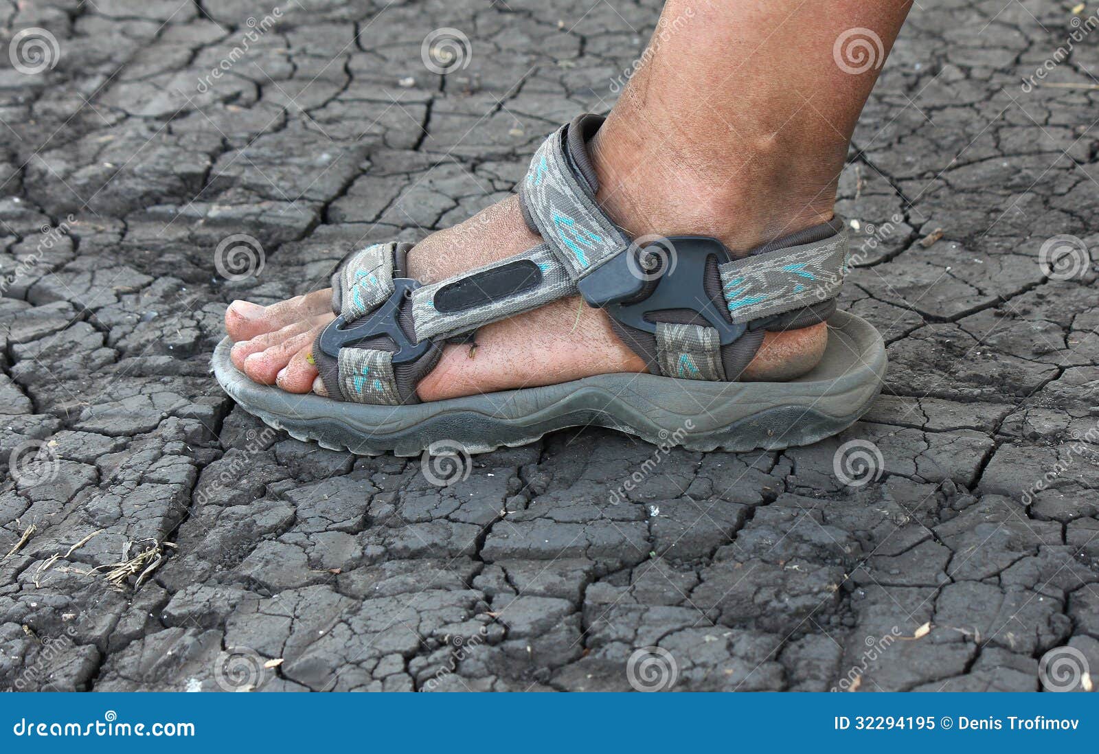 Human Foot in Sandals on the Cracked Earth Stock Image - Image of ...
