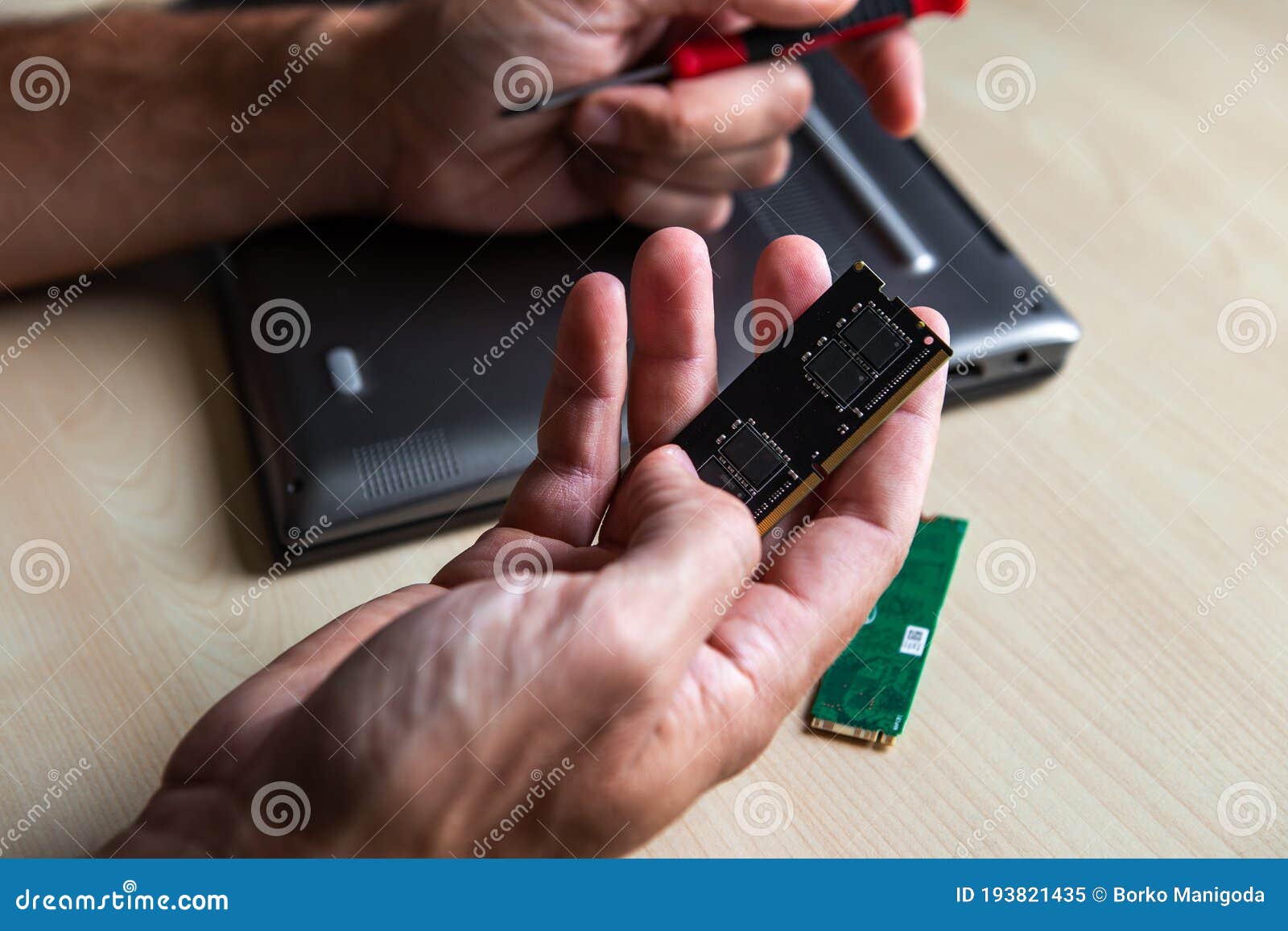 A Human Hand with a Computer Memory Frame. he Wants To Install it in ...