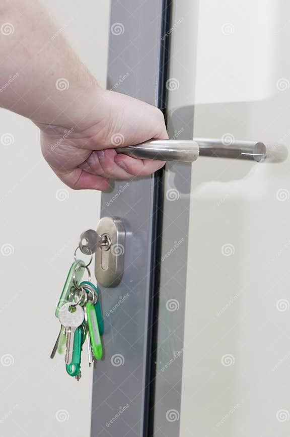 Human Hand on the Door Handle Stock Photo - Image of keys, house: 24278078