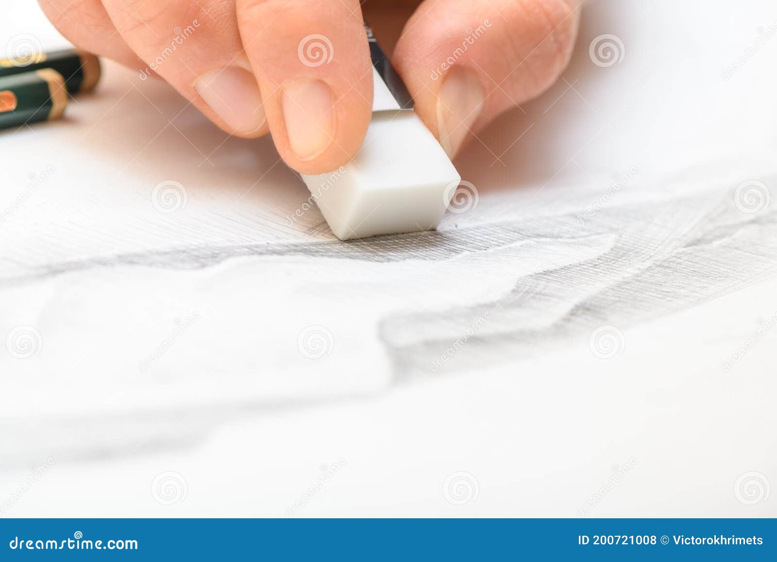 Human Hand is Erasing Graphite Draw on White Paper. Close Up View Stock ...