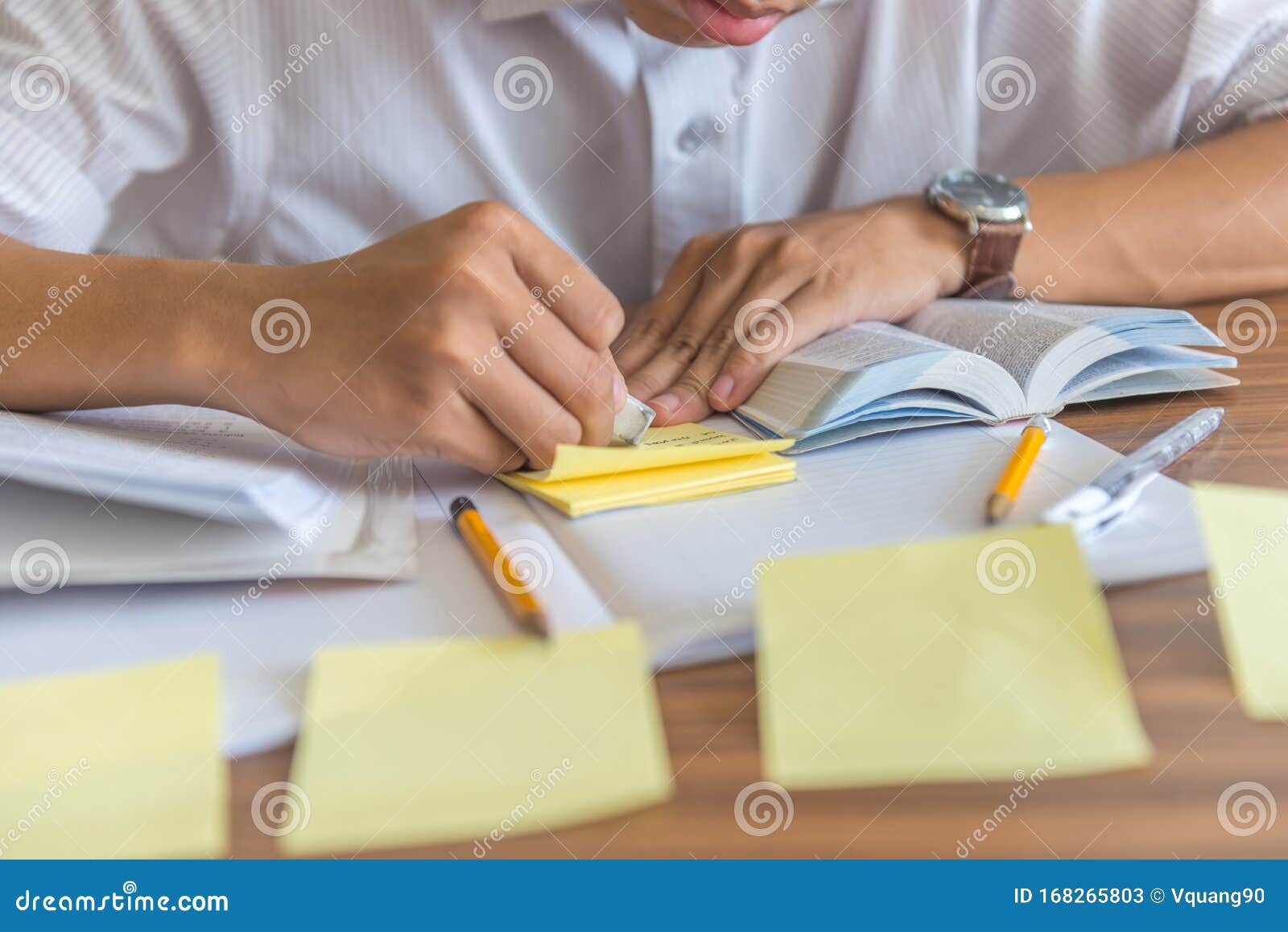 Human Hand Erasing Some Words on Sticky Note Stock Image - Image of ...