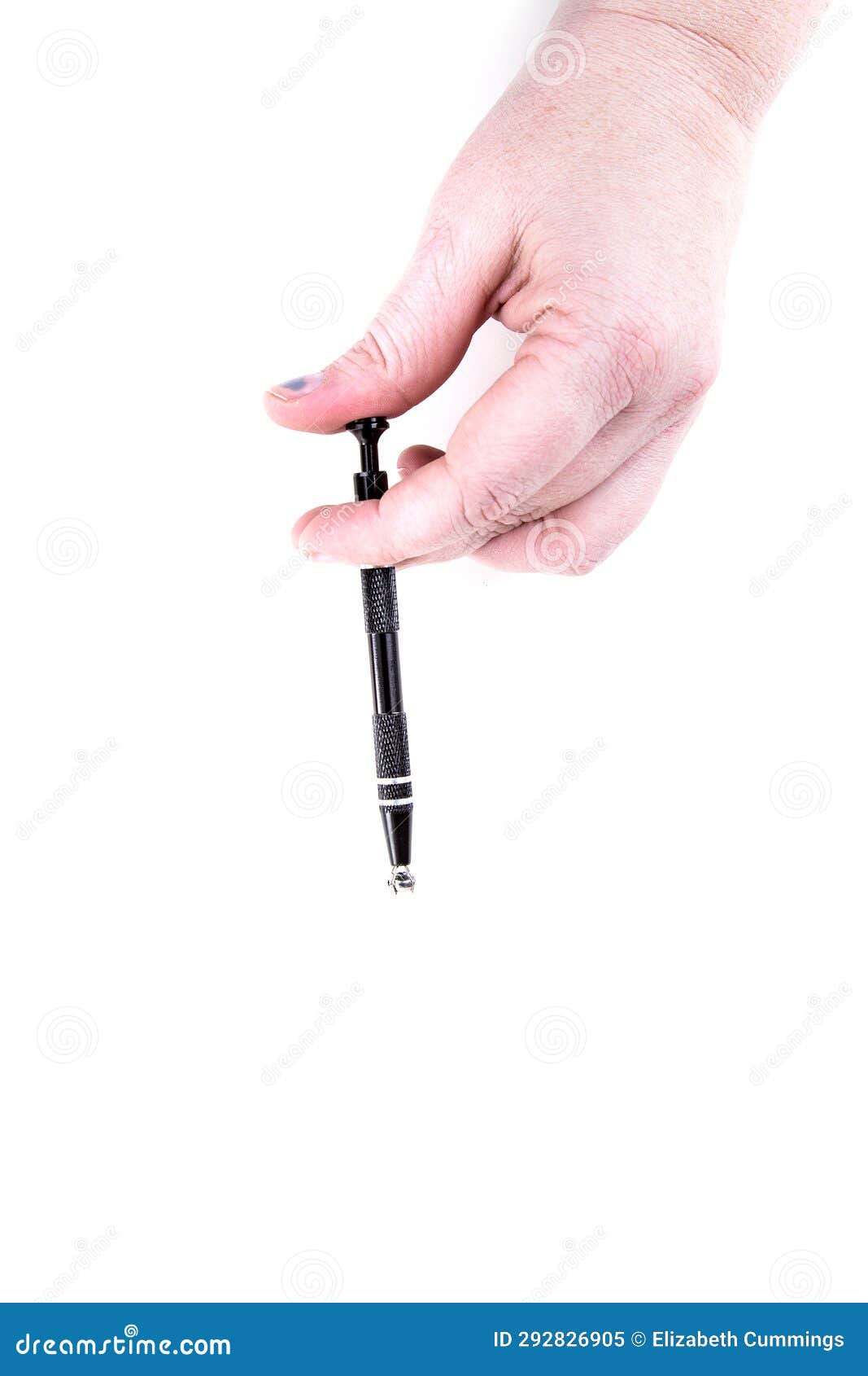 Human Hand Grasping a Bead with a Wire Grabber Tool Stock Image - Image ...