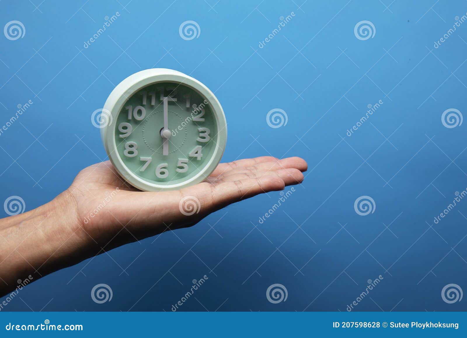 Human Hand Holding Alarm Clock Stock Photo - Image of deadline ...