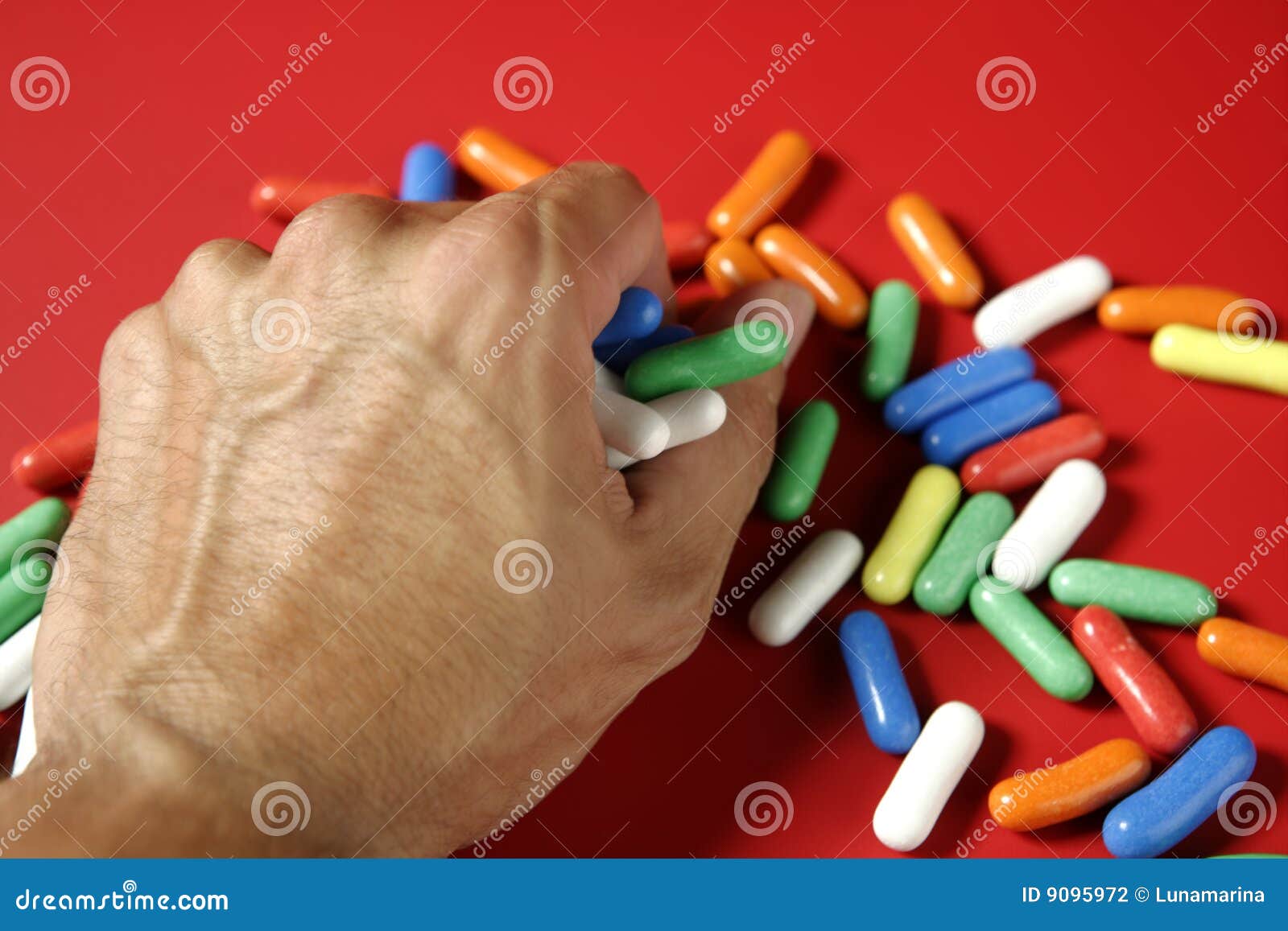 Human Hand Holding Colorful Candy Stock Photography - Image: 9095972