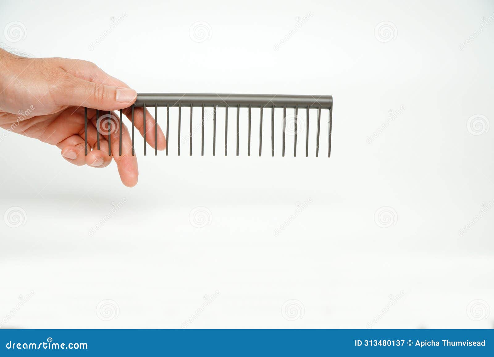 Human Hand Holding a Comb on White Background Isolation Stock Image ...