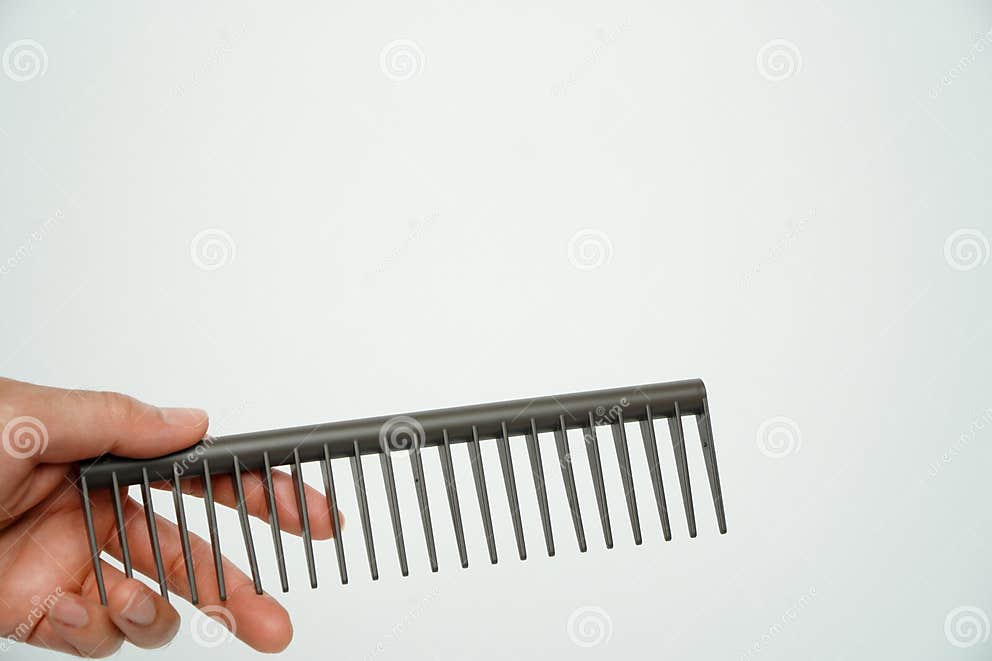 Human Hand Holding a Comb on White Background Isolation Stock Image ...