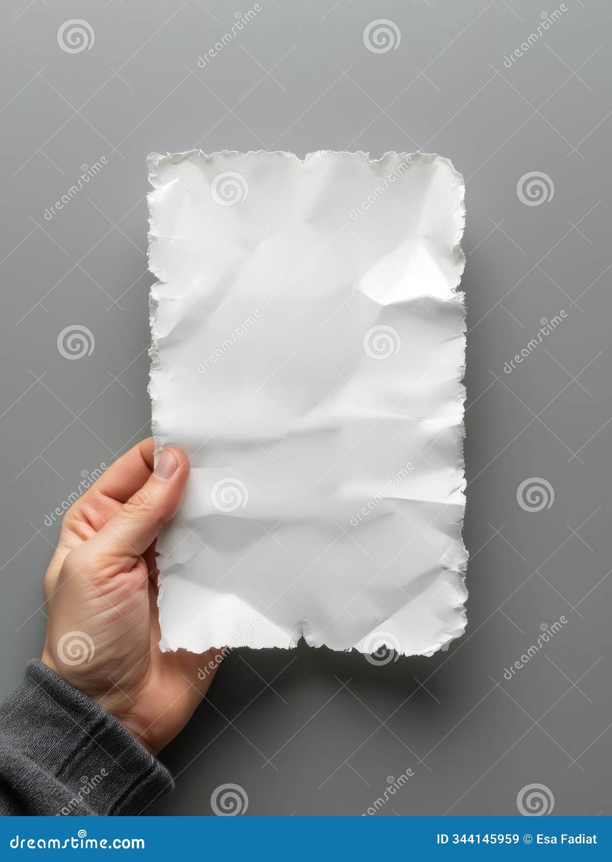 Human Hand Holding Crumpled White Paper with Torn Edges on Grey ...