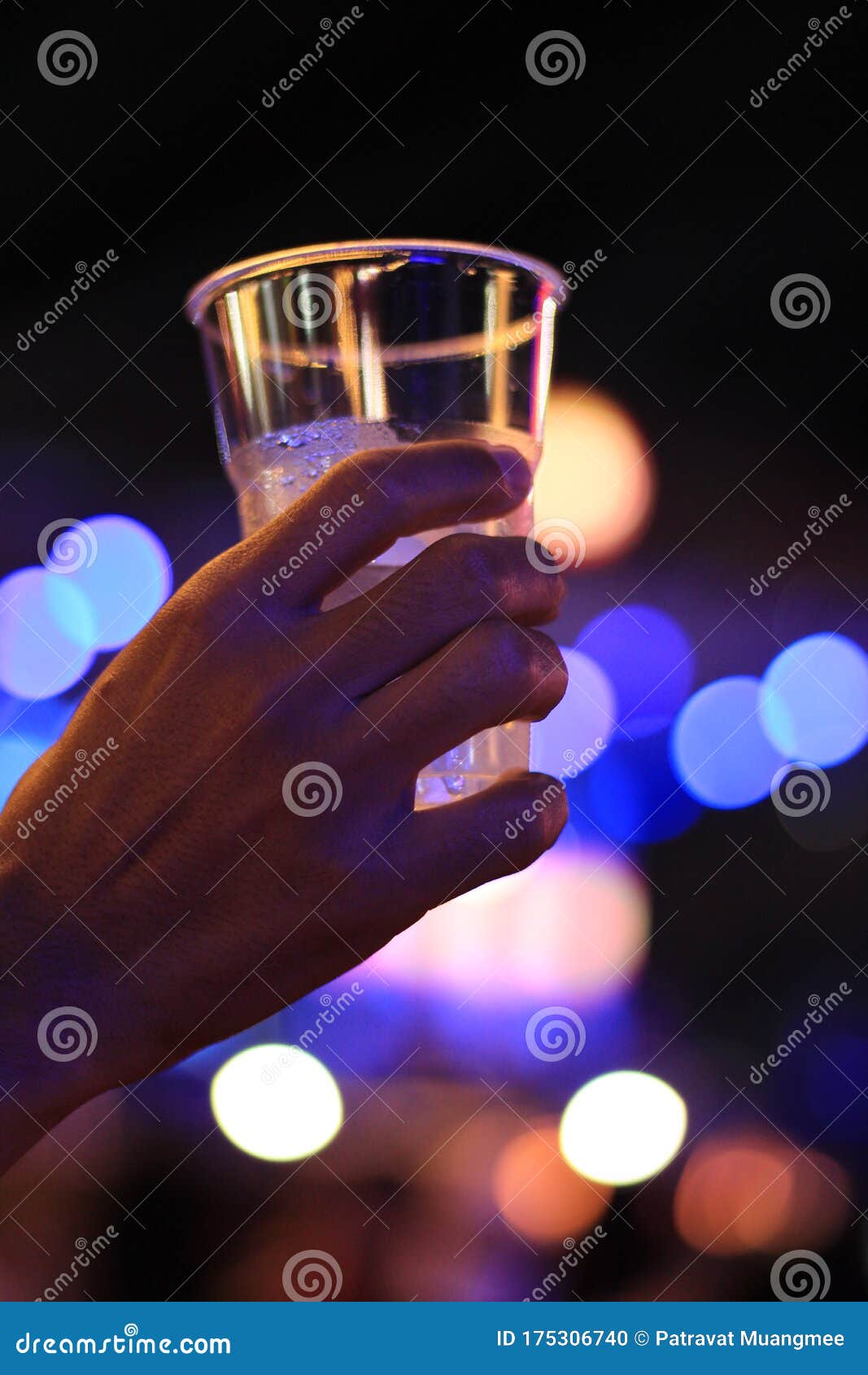 A Human Hand Holding a Glass at Night. Stock Photo - Image of holding ...