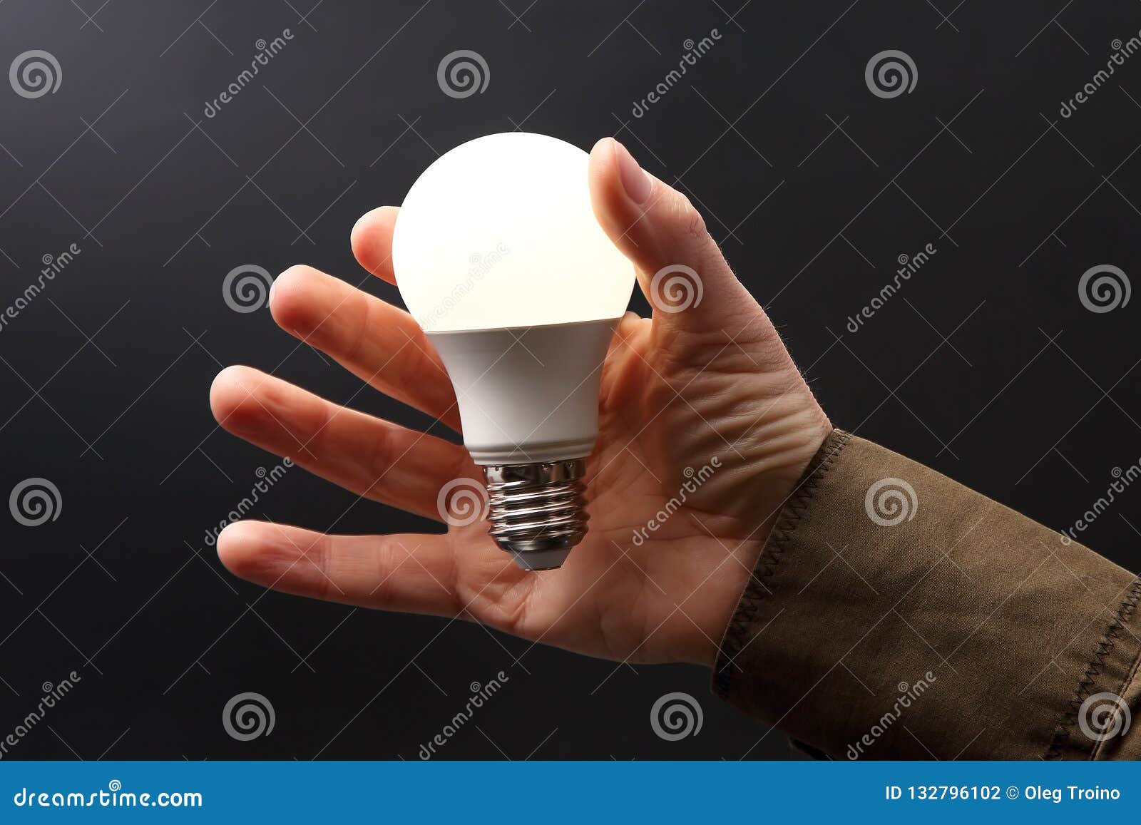 Human Hand Holding the Included Led Lamp on a Dark Background Stock ...