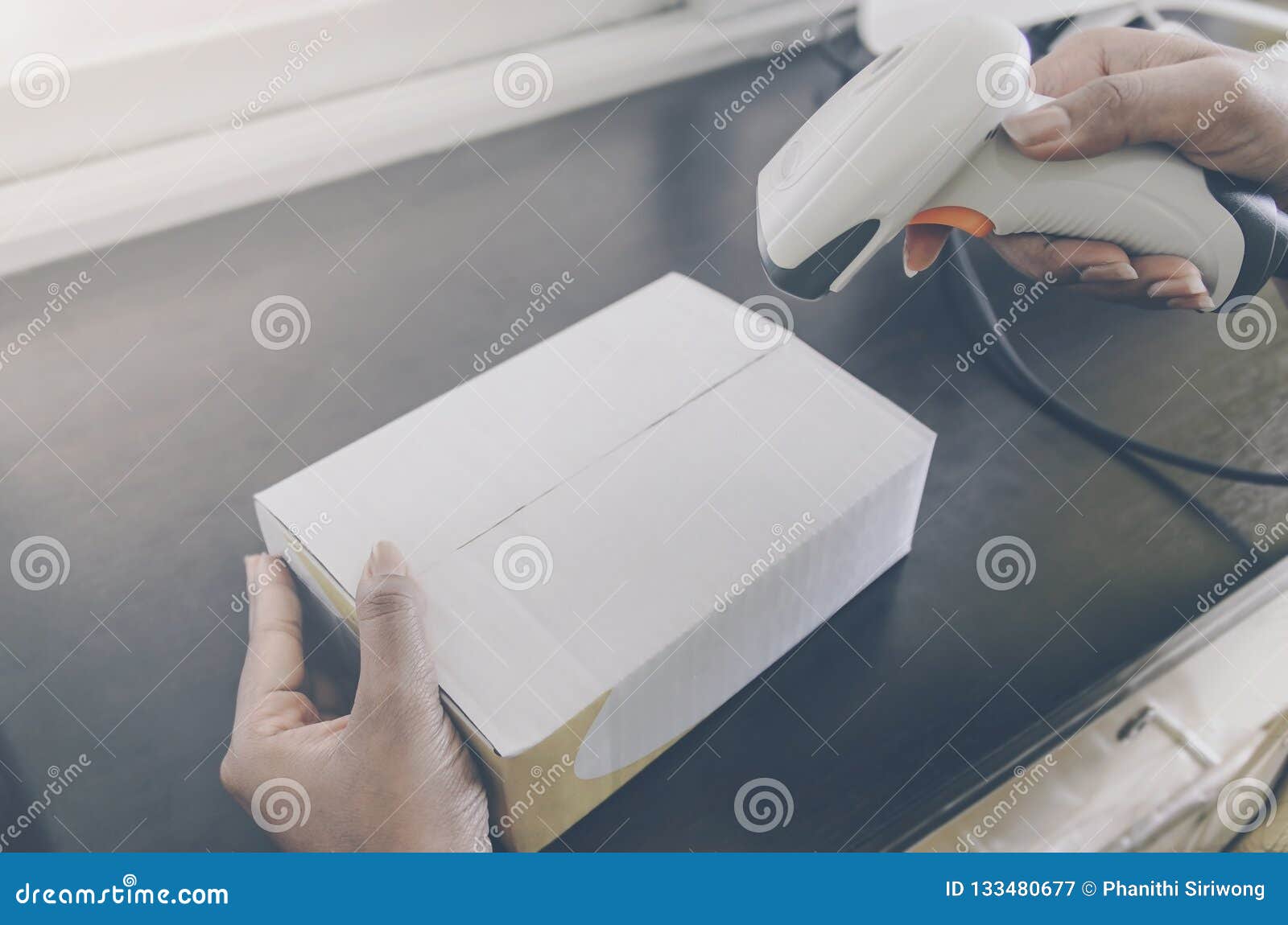 A Human Hand Holding Parcel with Barcode Reader for Delivery Stock ...