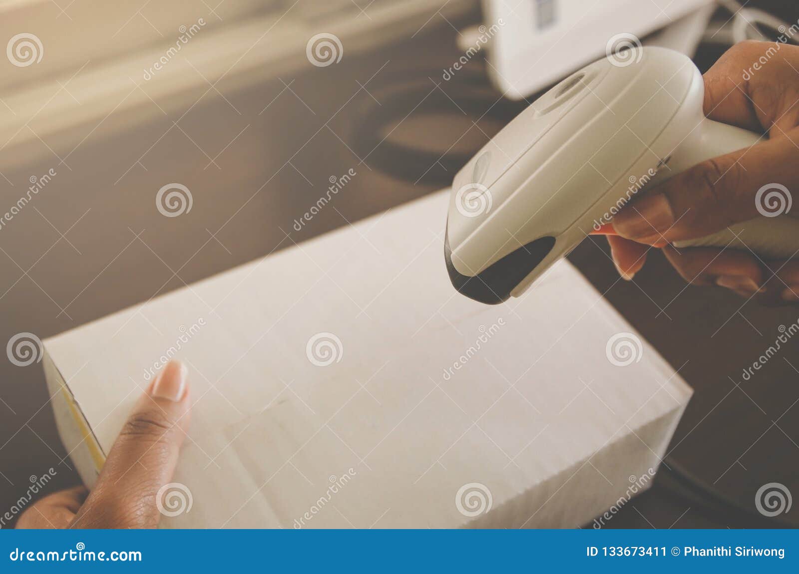 A Human Hand Holding Parcel with Barcode Reader for Delivery Stock ...