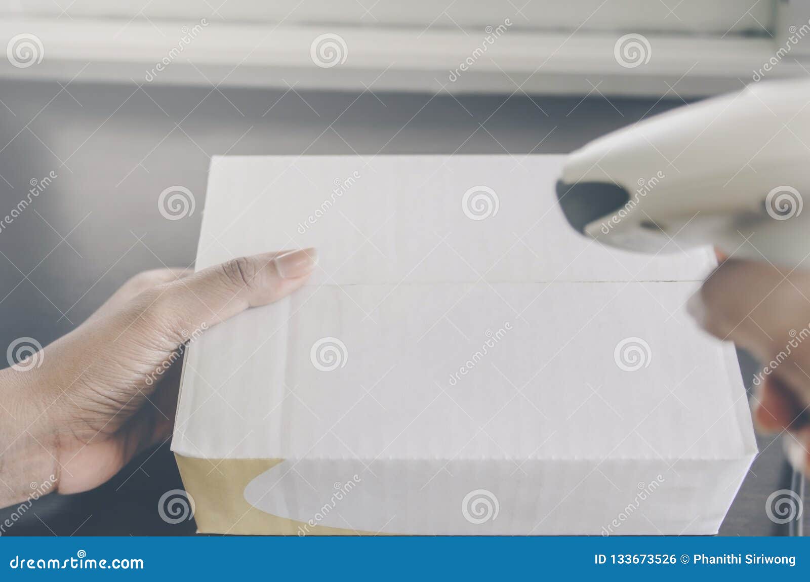 A Human Hand Holding Parcel with Barcode Reader for Delivery Stock ...