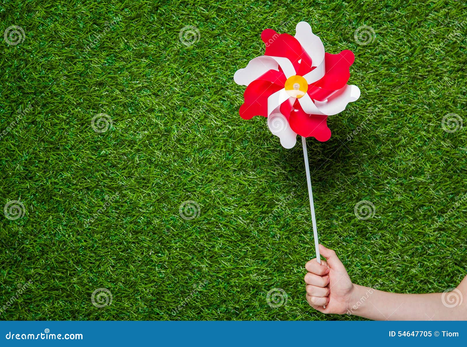 Human Hand Holding Pinwheel Over Grass Stock Image - Image of wind ...