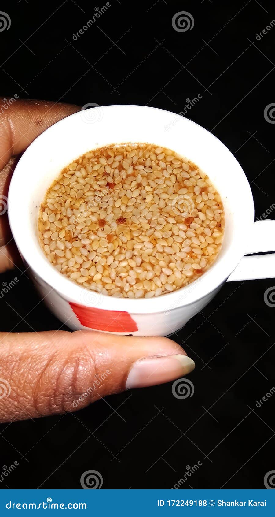 Human Hand Holding a Tea Cup with Black Background Stock Photo - Image ...