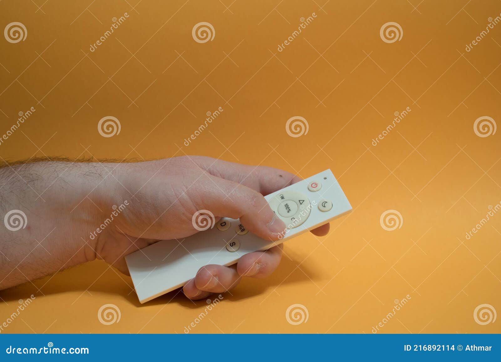 Human Hand Holding White Remote Control Adjusting the Electric Light ...