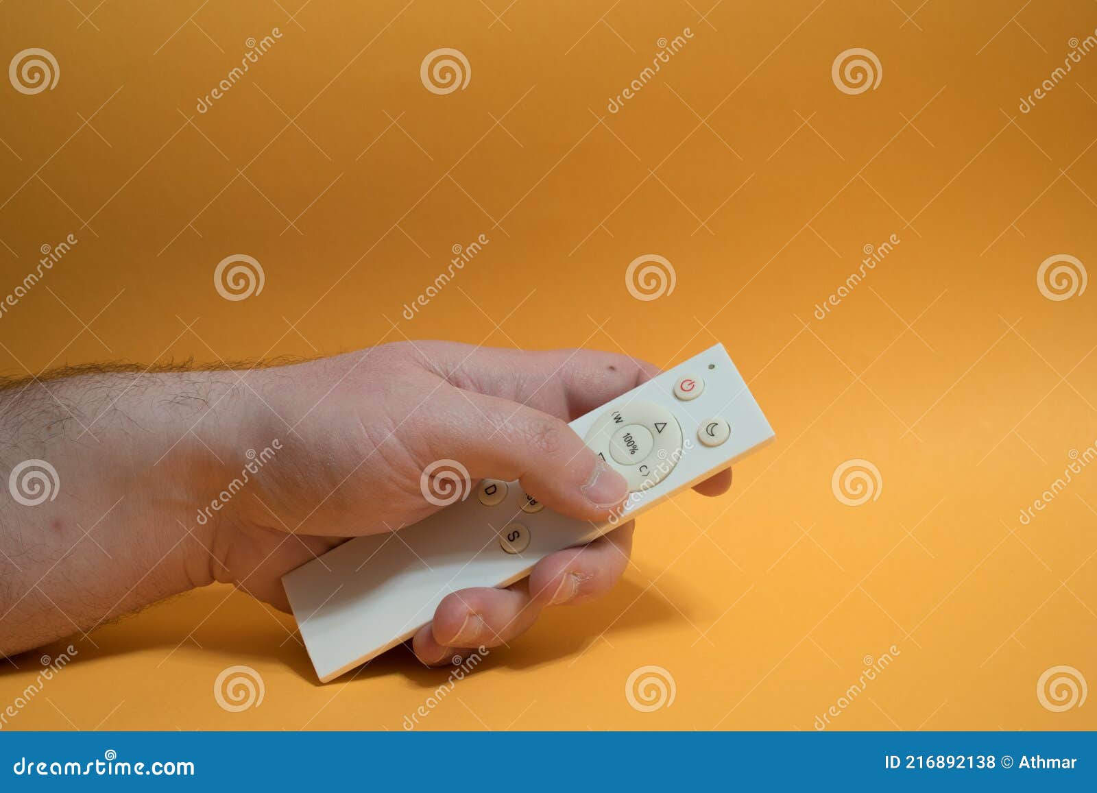 Human Hand Holding White Remote Control Adjusting the Electric Light ...