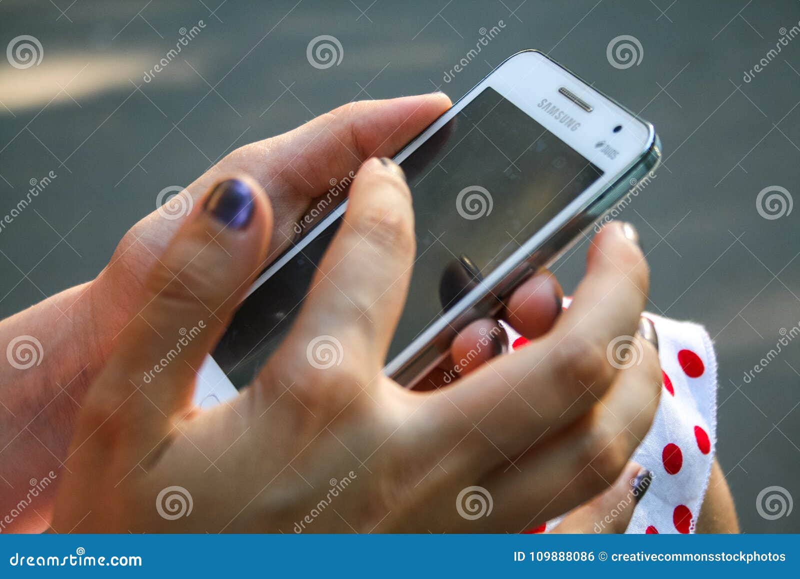 Human Hand Holding White Samsung Duos Android Smartphone Picture. Image ...