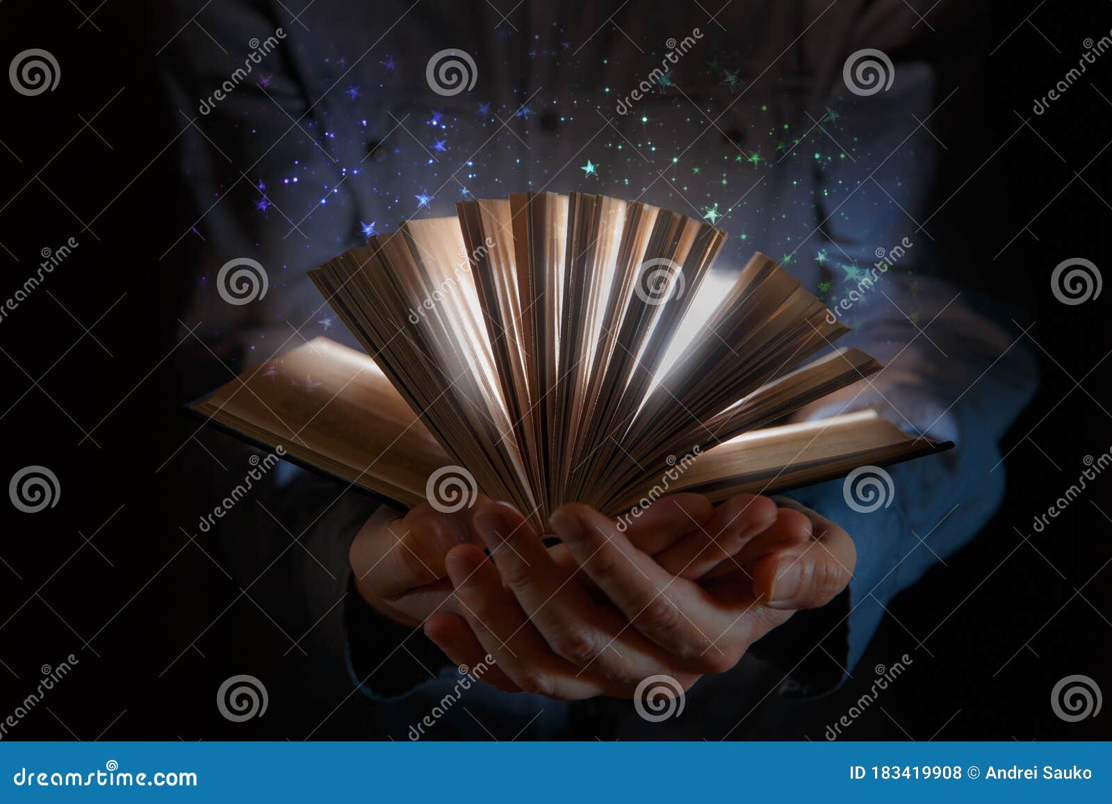 Human Hand Holding Magic Book with Magic Lights Stock Photo - Image of ...
